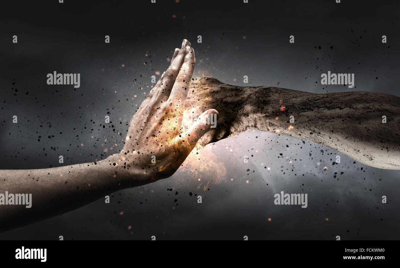 One hand preventing punch attack of another hand Stock Photo - Alamy