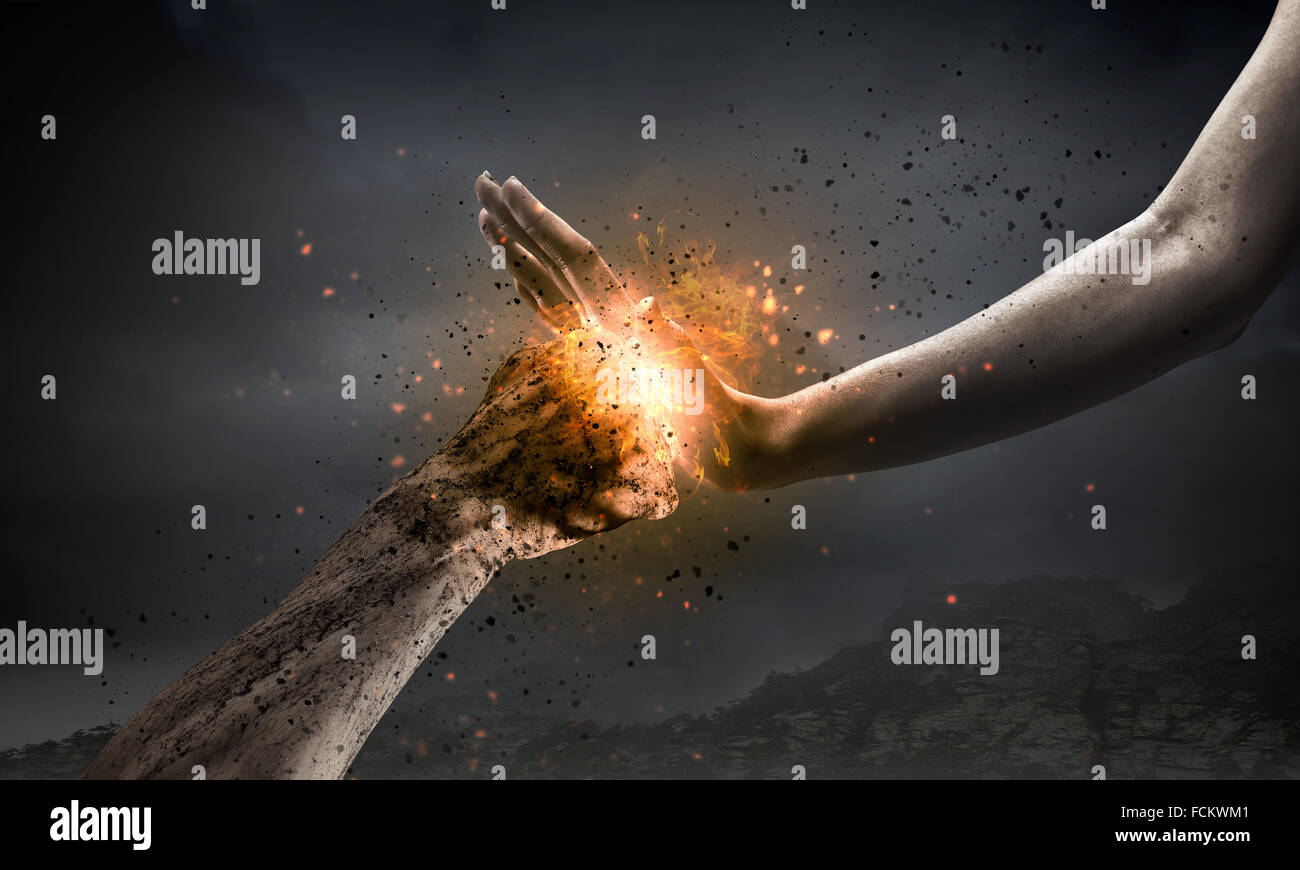 One hand preventing punch attack of another hand Stock Photo - Alamy
