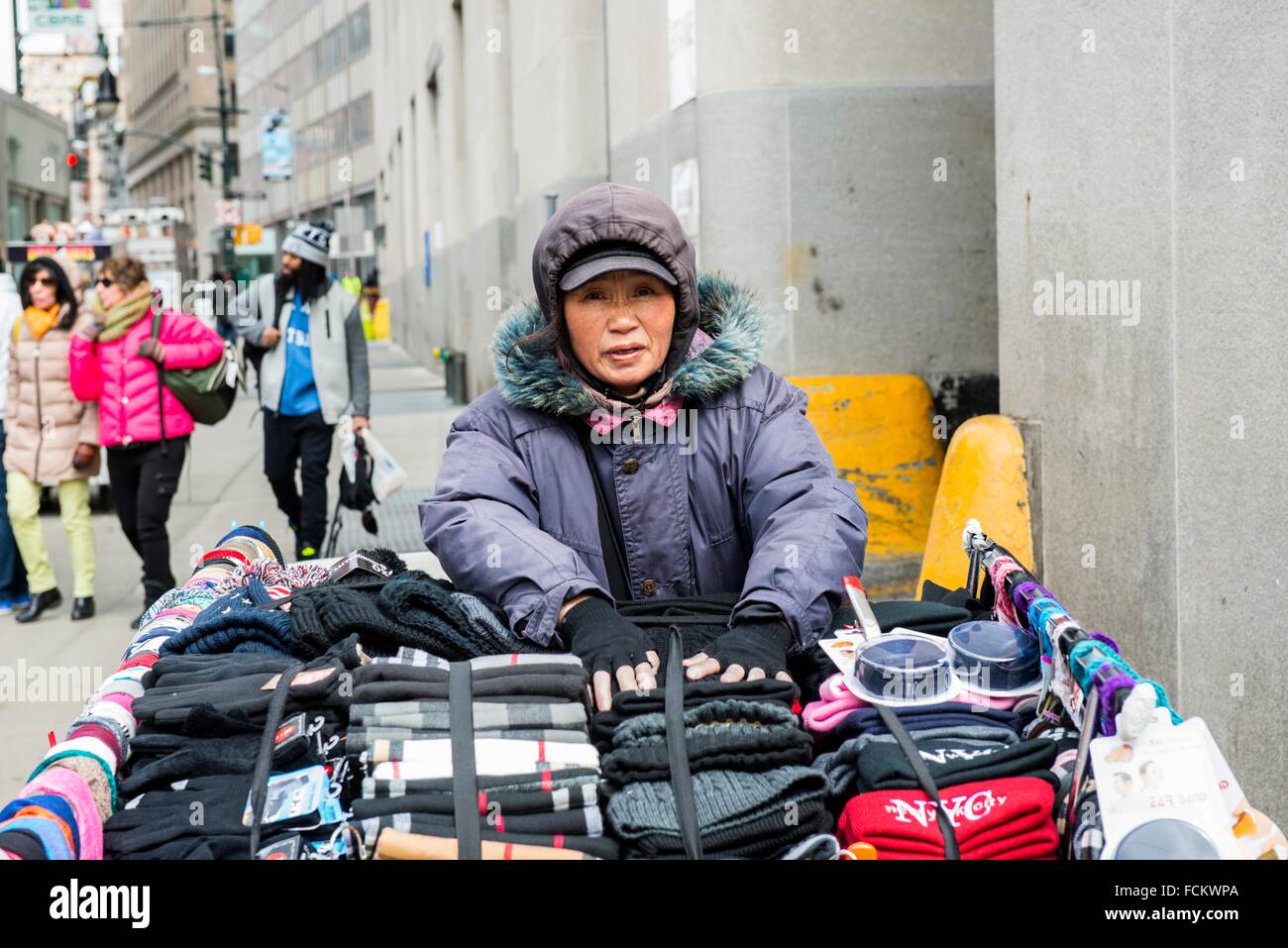 New York, USA. Chinese woman selling hads and gloves from her street ...