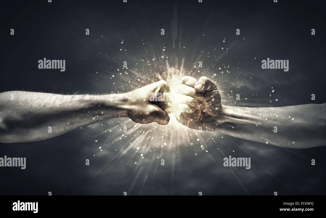 One hand preventing punch attack of another hand Stock Photo - Alamy