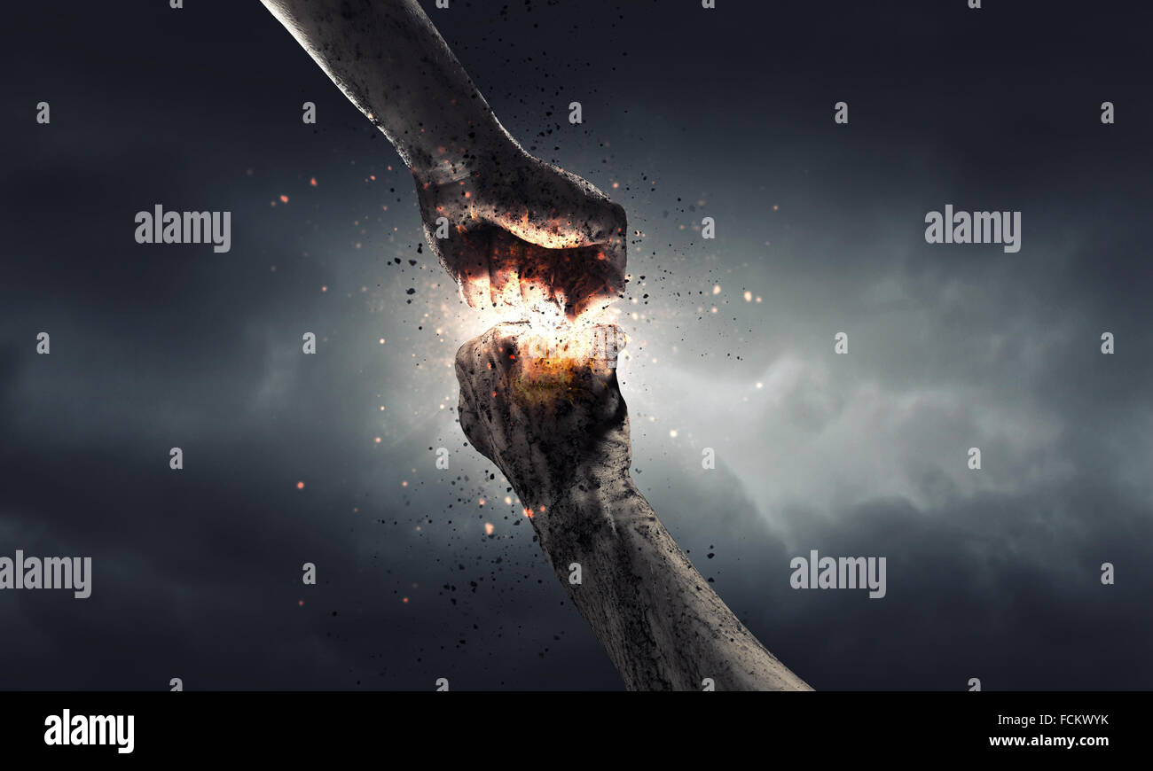 One hand preventing punch attack of another hand Stock Photo - Alamy