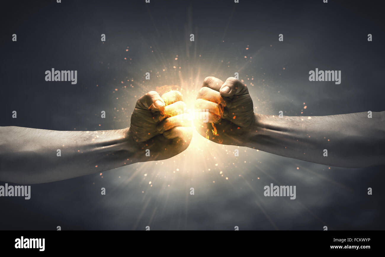 One hand preventing punch attack of another hand Stock Photo - Alamy
