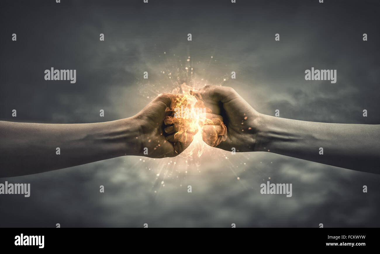 One hand preventing punch attack of another hand Stock Photo - Alamy