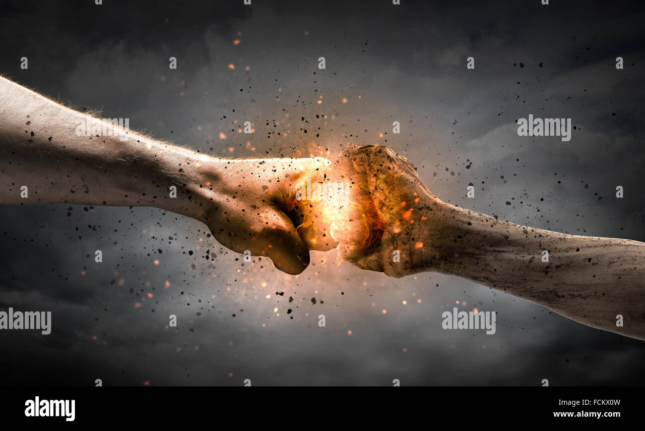 One hand preventing punch attack of another hand Stock Photo - Alamy