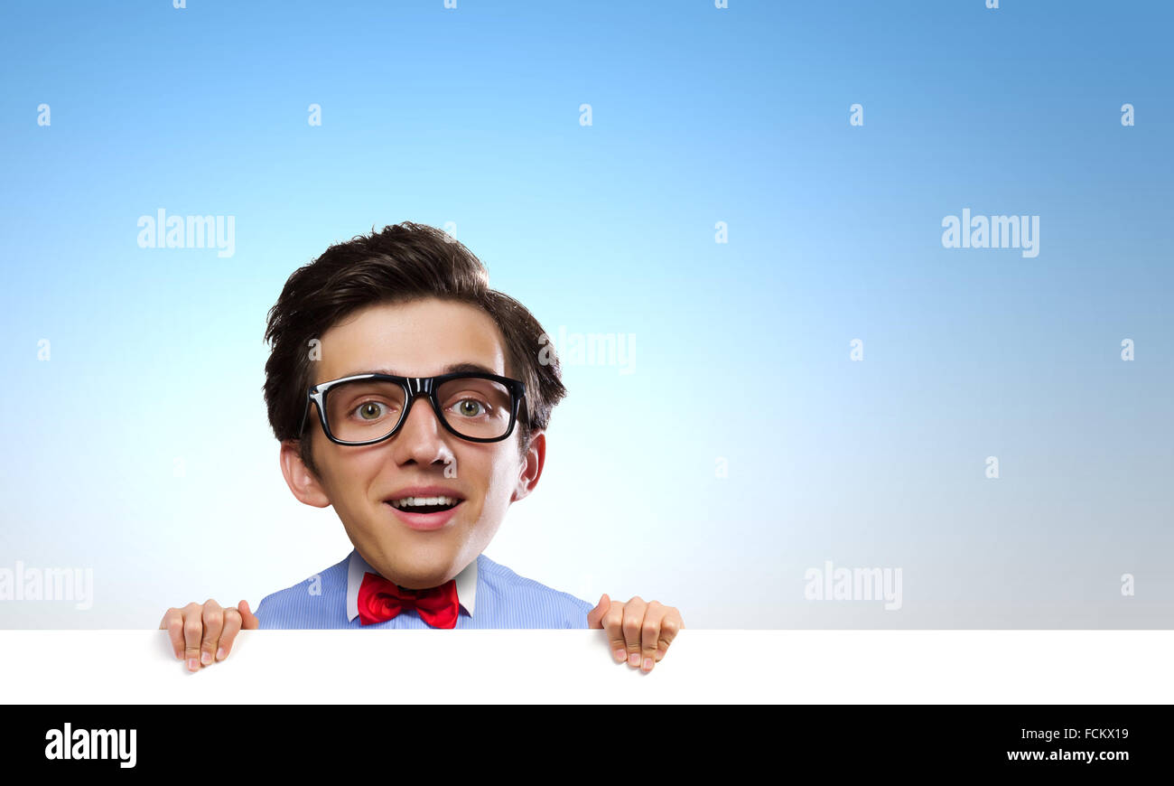 Young funny man with big head holding banner Stock Photo - Alamy
