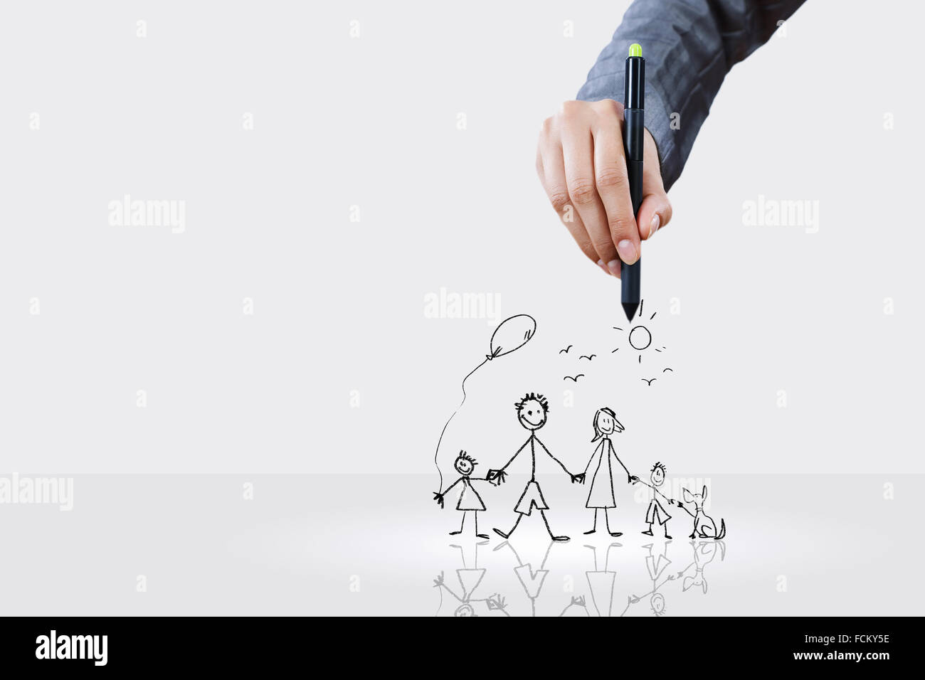 Close up of hand drawing sketches of happy family Stock Photo - Alamy