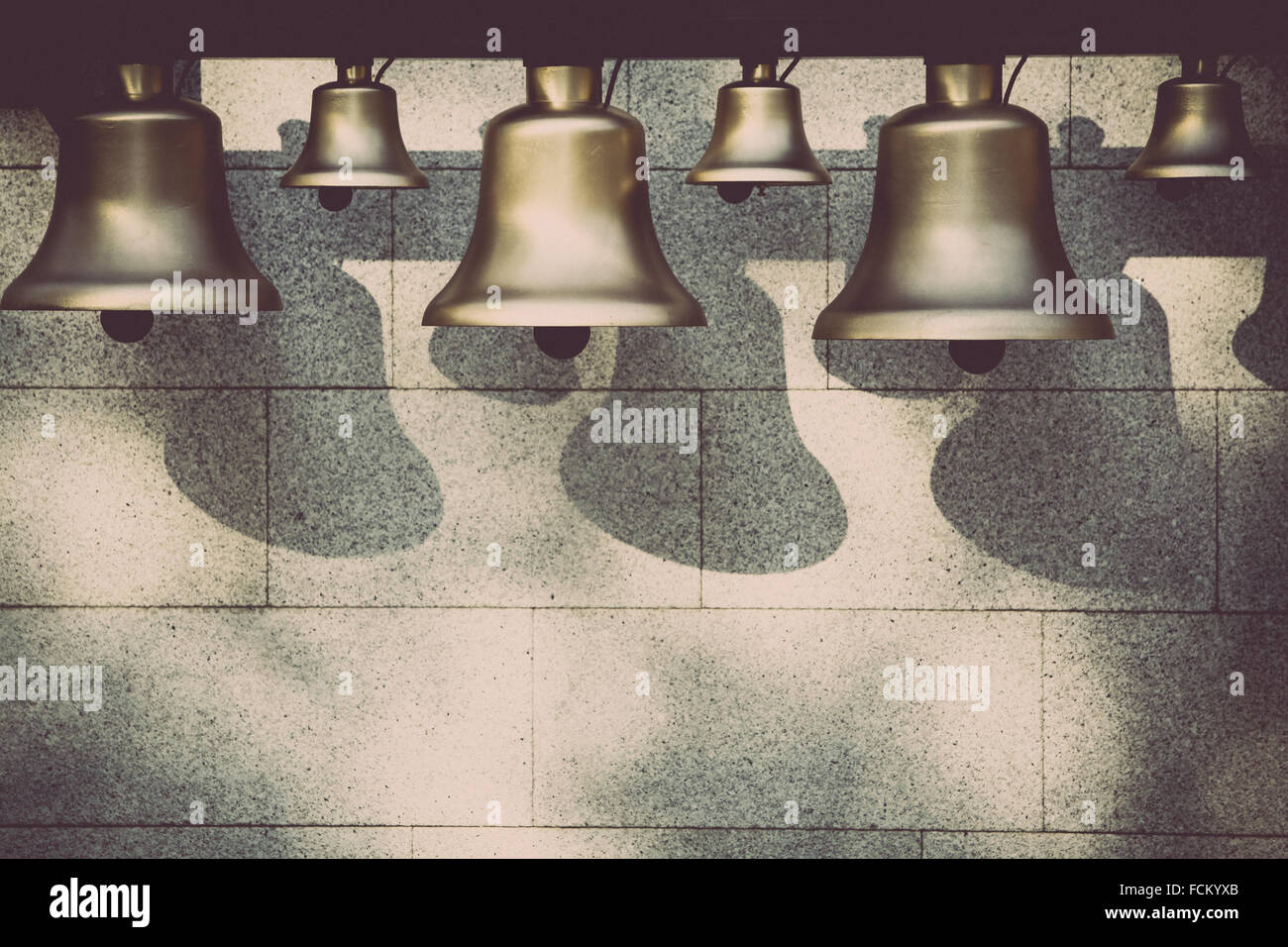 Color image of some various sized bells in a row Stock Photo - Alamy