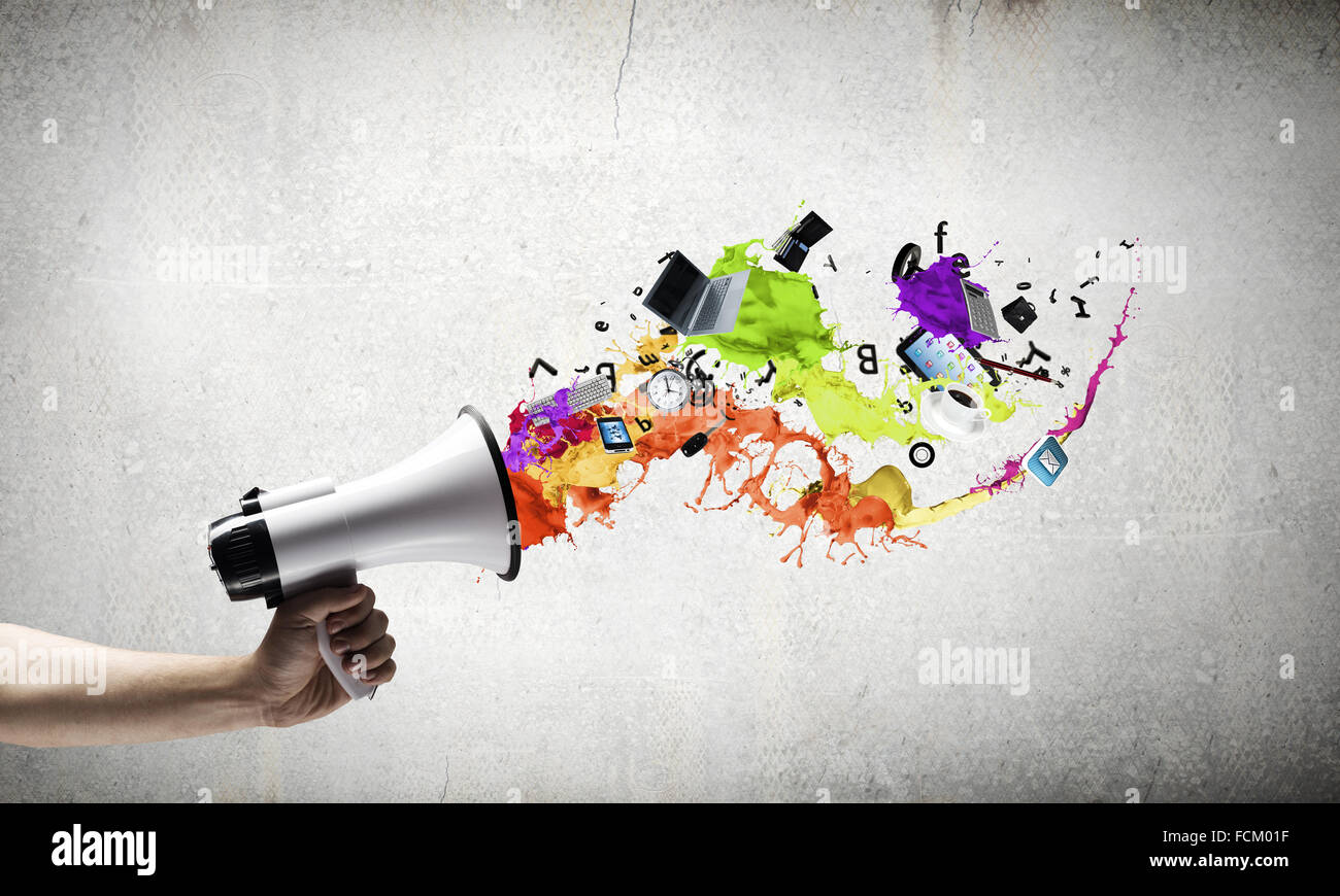 Close up of human hand holding megaphone Stock Photo - Alamy