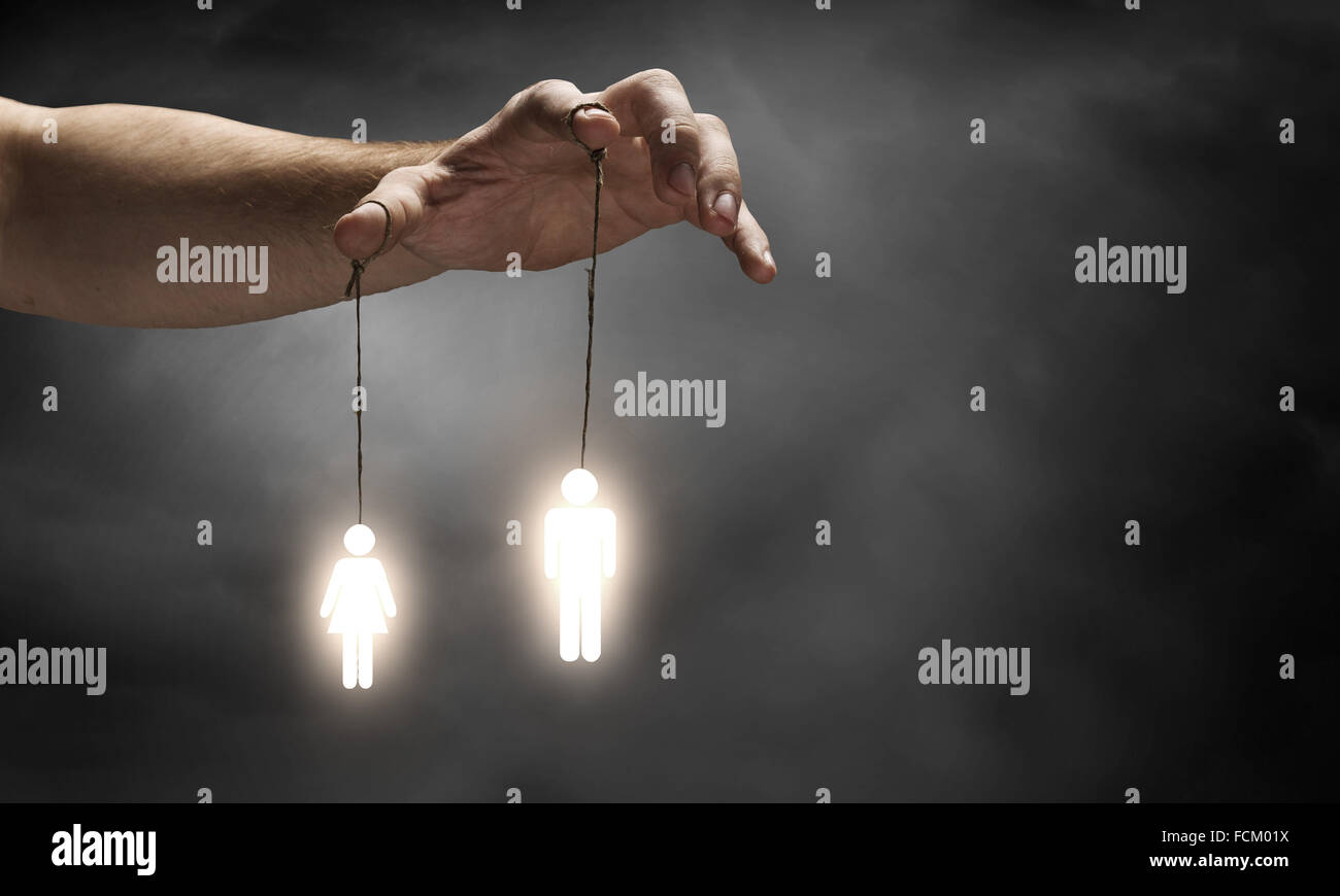 Close up of human hand and people hanging on fingers Stock Photo - Alamy