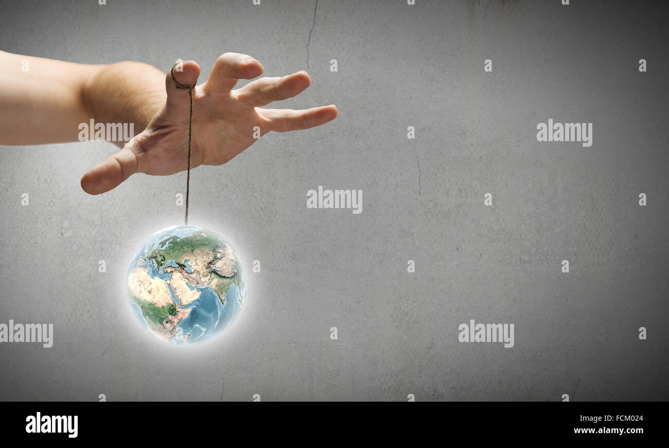 Close up of human hand and items hanging on fingers. Elements of this ...
