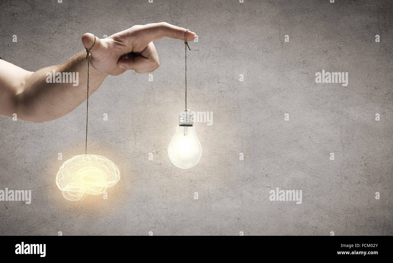 Close up of human hand and items hanging on fingers Stock Photo - Alamy