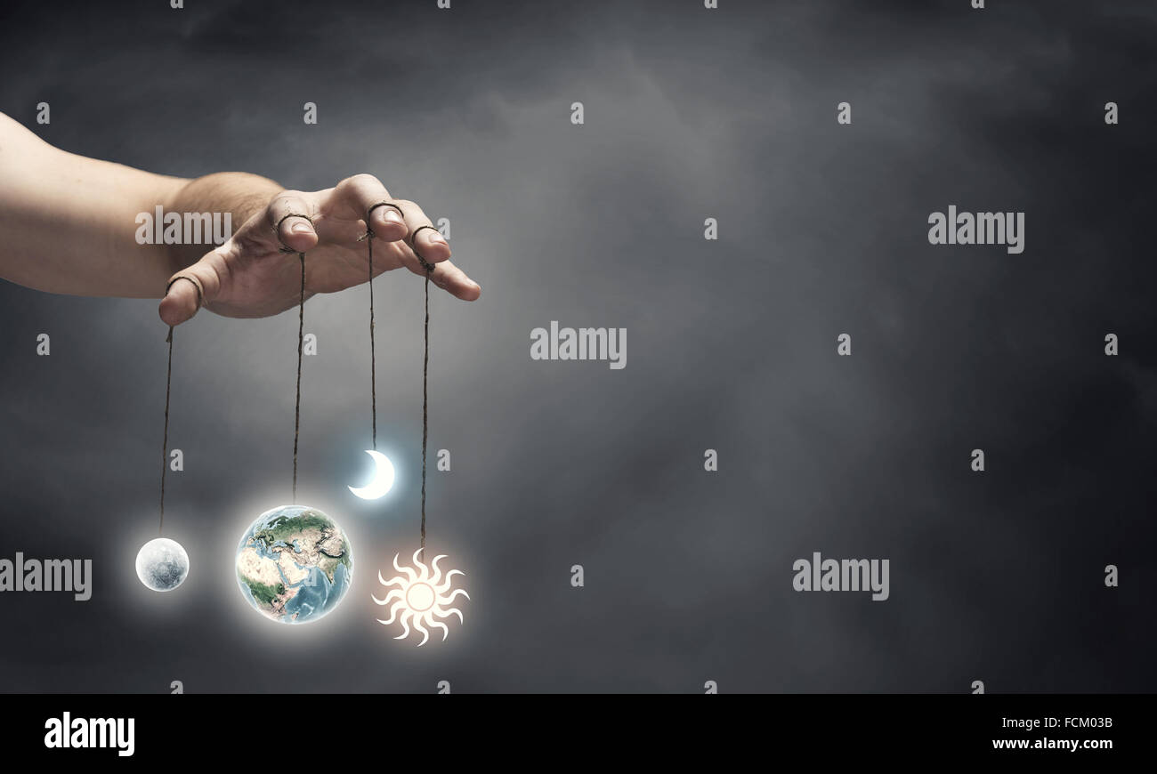 Close up of human hand and items hanging on fingers. Elements of this ...