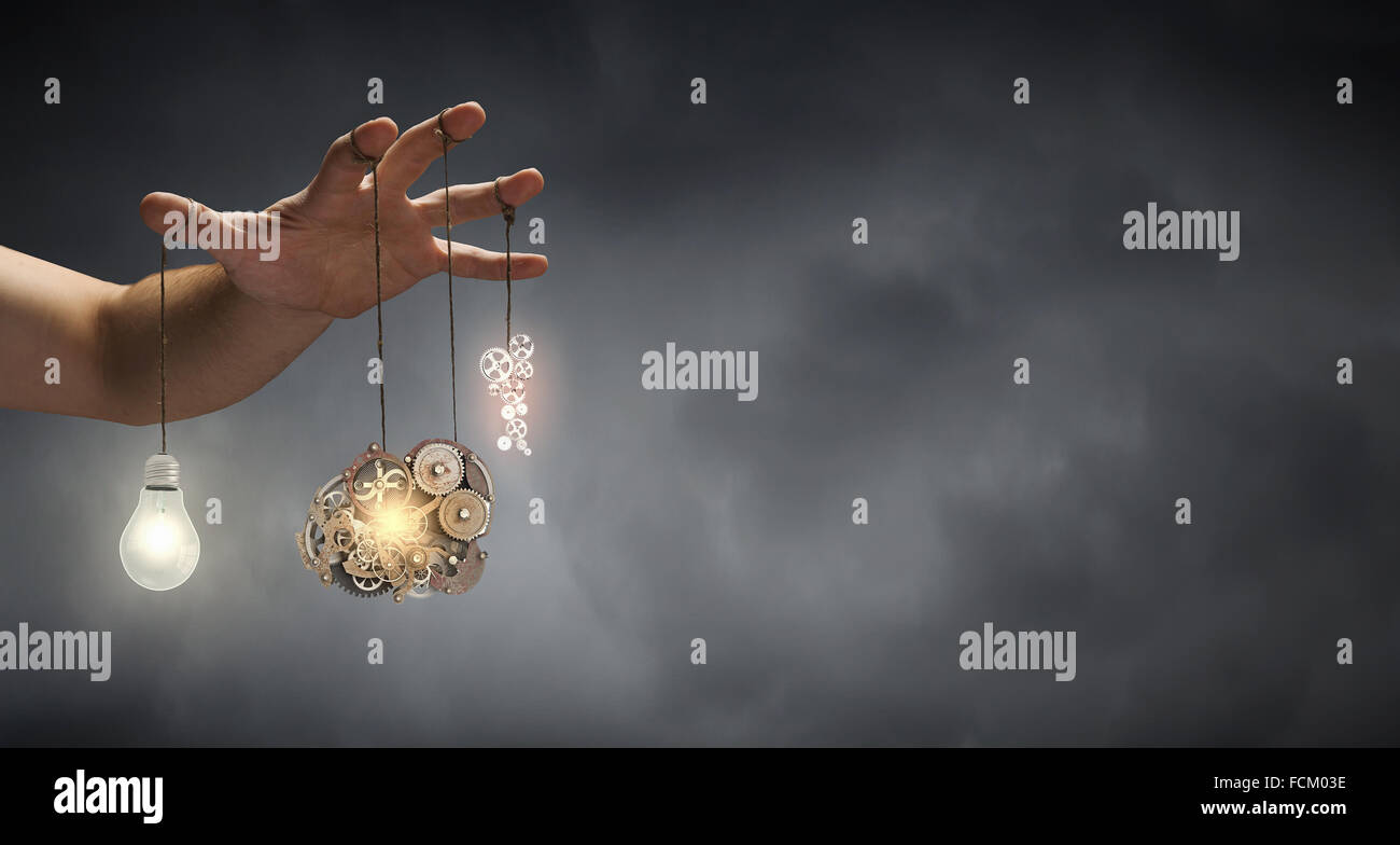 Close up of human hand and items hanging on fingers Stock Photo - Alamy