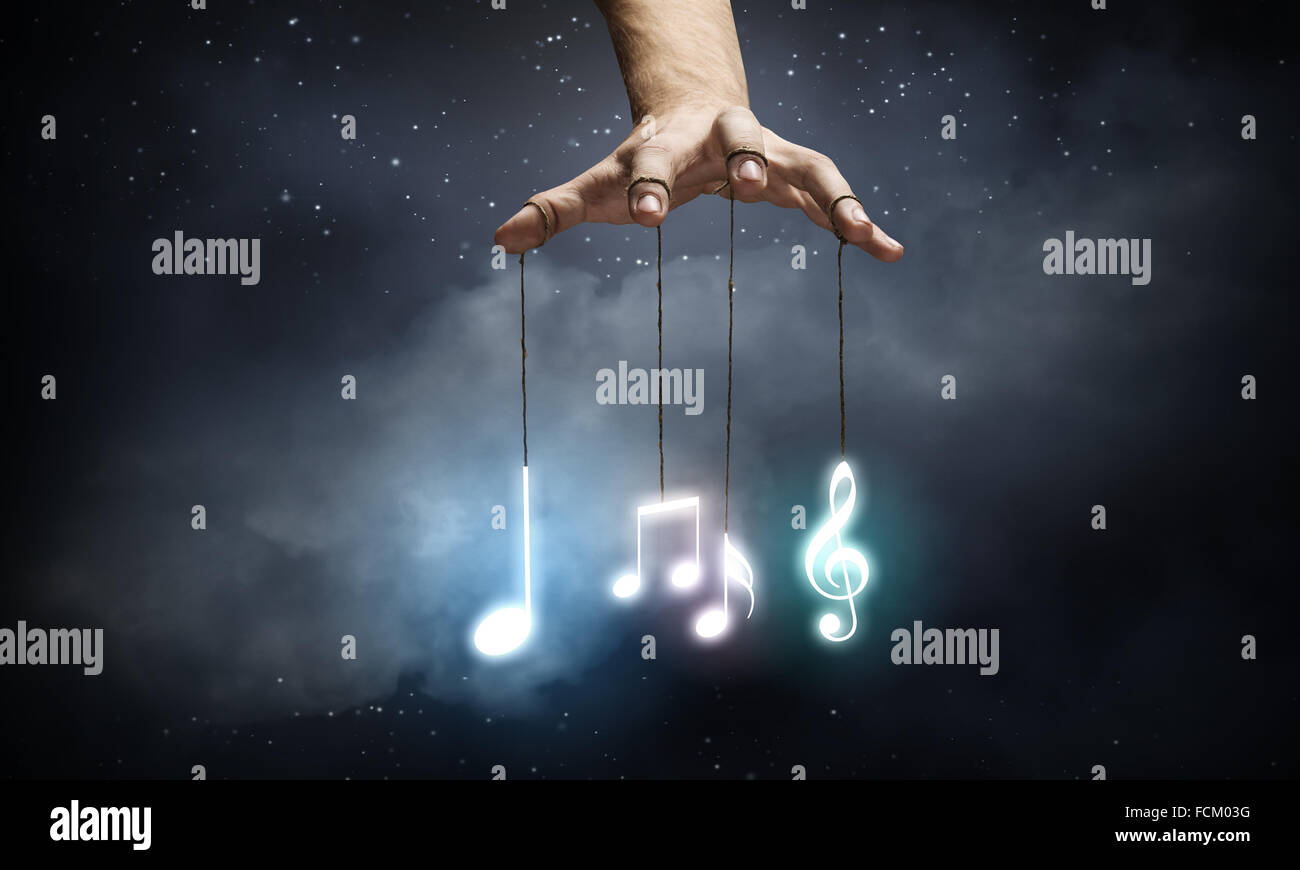 Close up of human hand and items hanging on fingers Stock Photo - Alamy