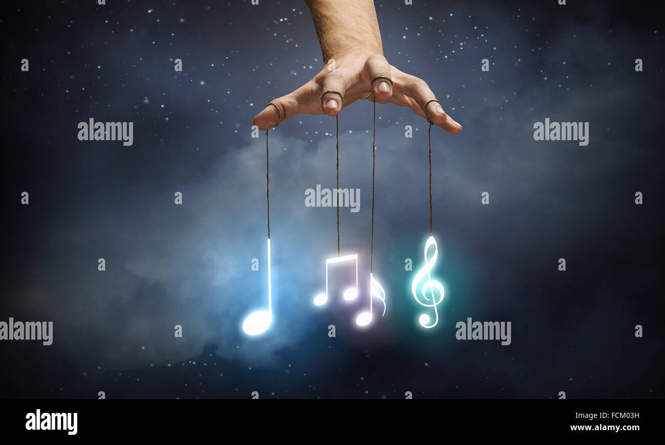 Close up of human hand and items hanging on fingers Stock Photo - Alamy