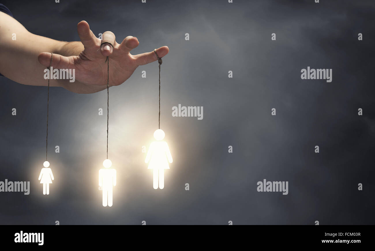 Close up of human hand and people hanging on fingers Stock Photo - Alamy