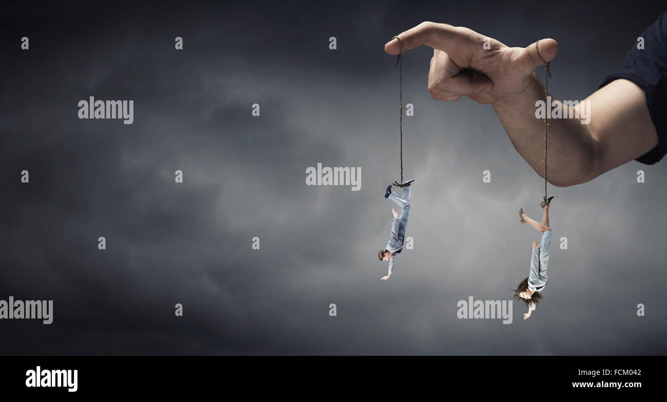 Close up of human hand and people hanging on fingers Stock Photo - Alamy