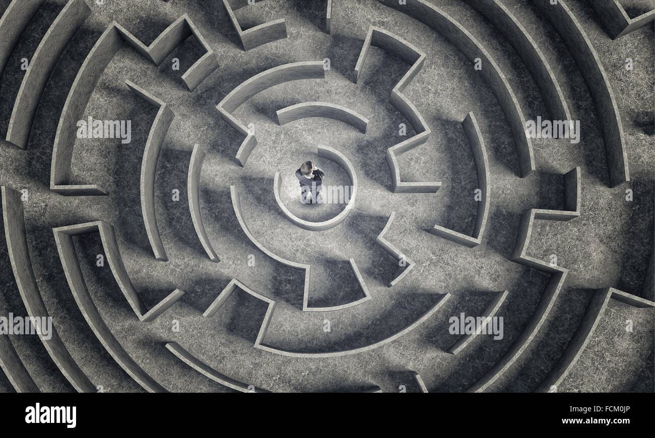 Puzzled businessman standing in center of labyrinth Stock Photo - Alamy