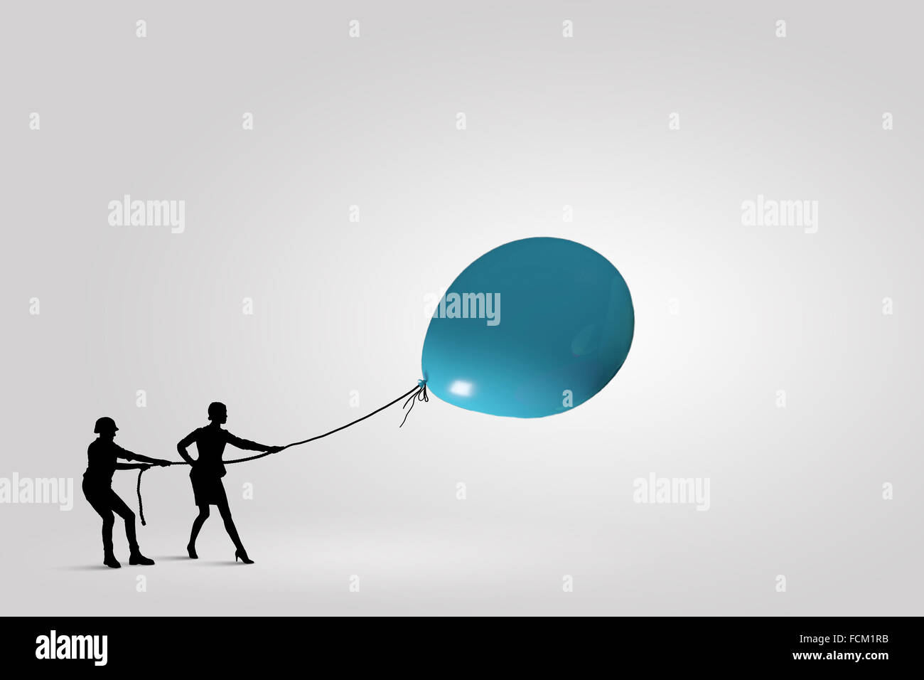 Little silhouettes of people pulling rope with balloon Stock Photo - Alamy