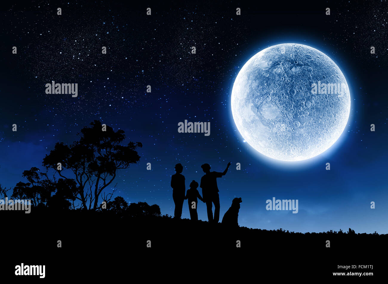 Silhouettes of happy family at night under full moon Stock Photo - Alamy