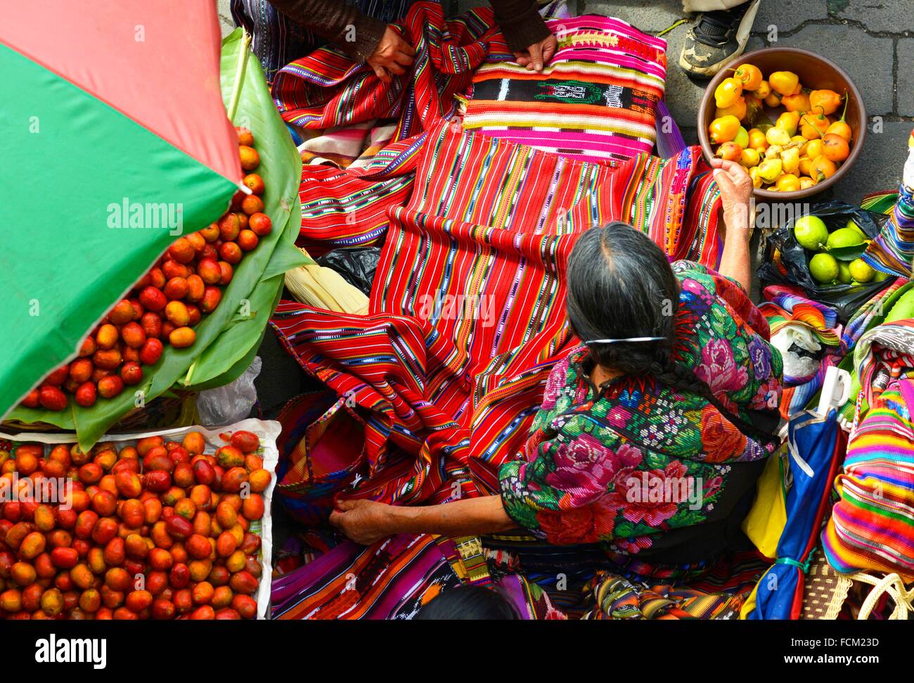 Mayan woman selling traditional Mayan textile in Chichicastenango ...