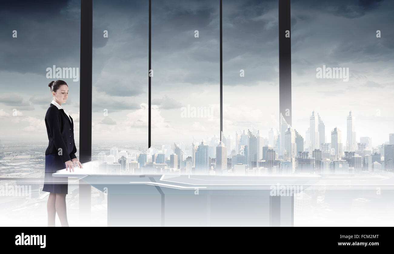 Young businesswoman examining model of construction project hi-res ...