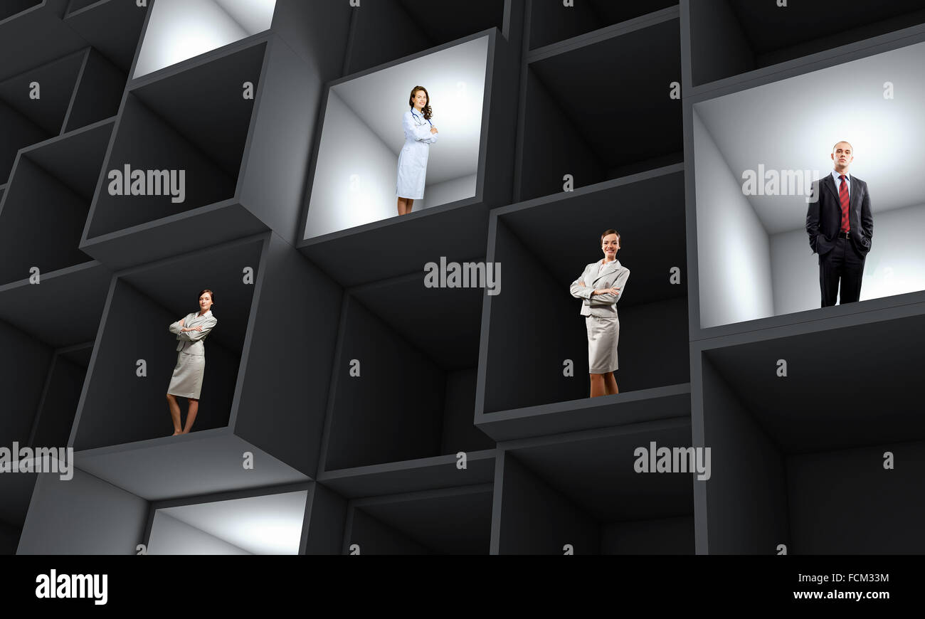 Miniatures of business people standing in cube Stock Photo - Alamy