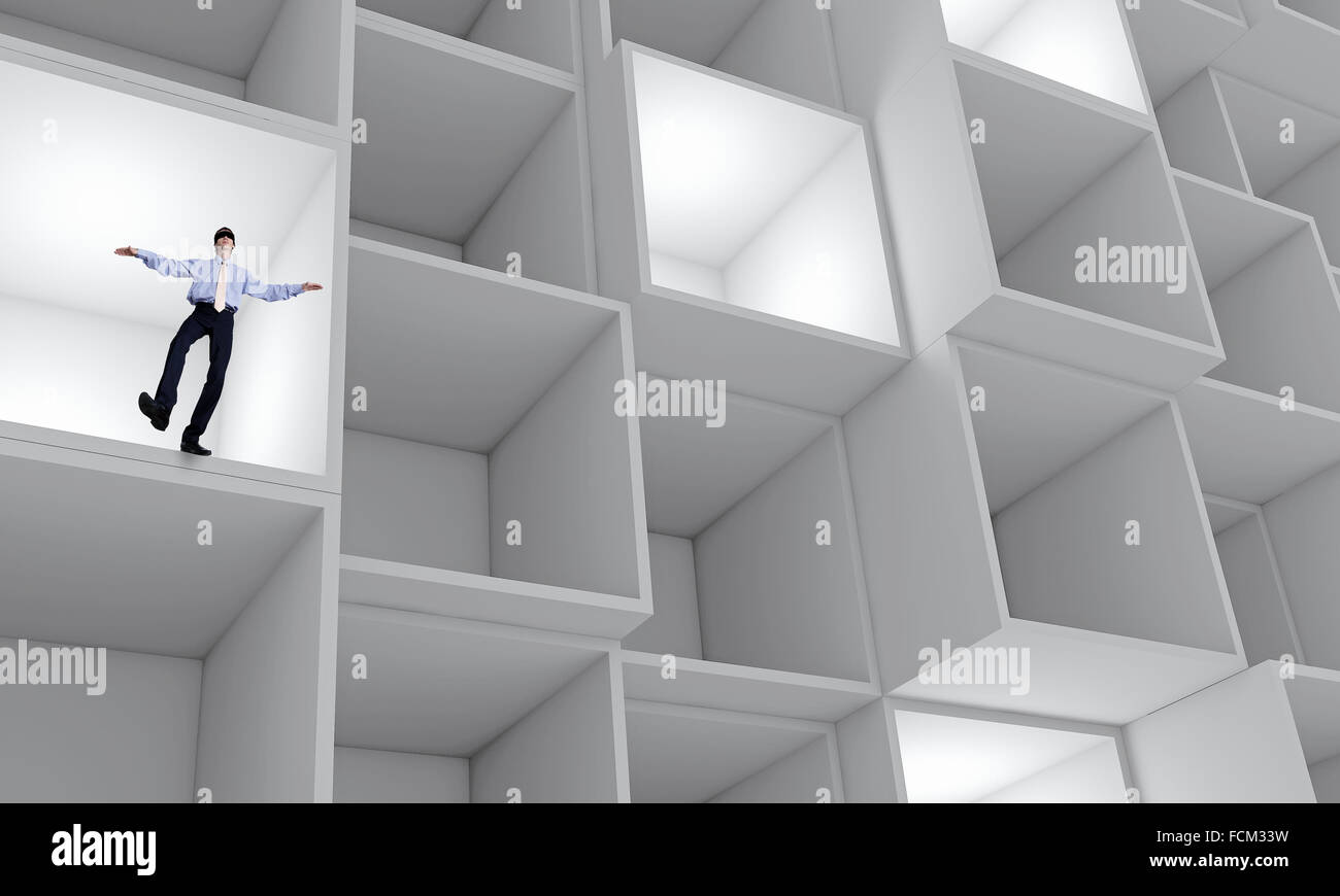 Miniature of businessman walking in white cube Stock Photo - Alamy
