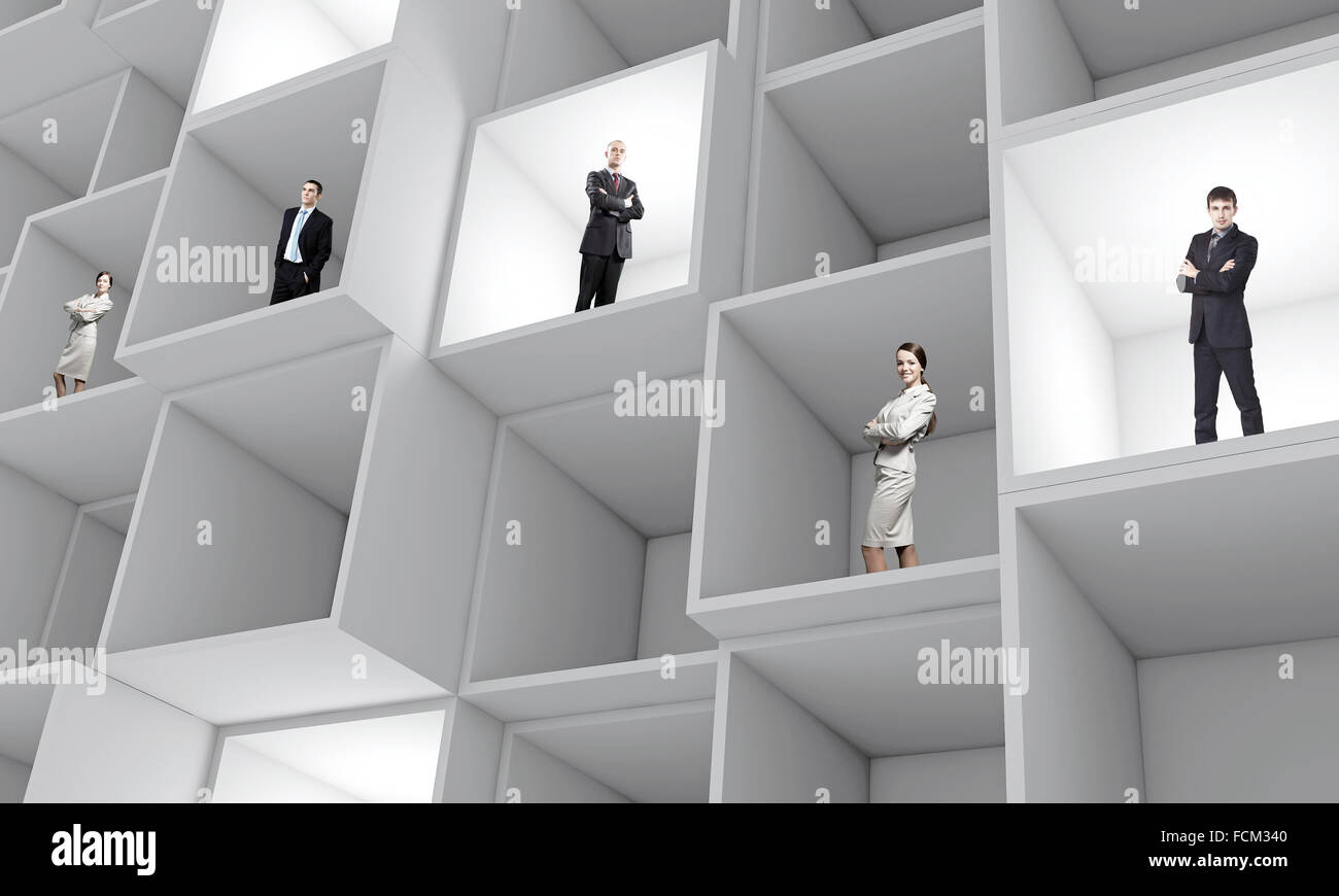 Miniatures of business people standing in cube Stock Photo - Alamy
