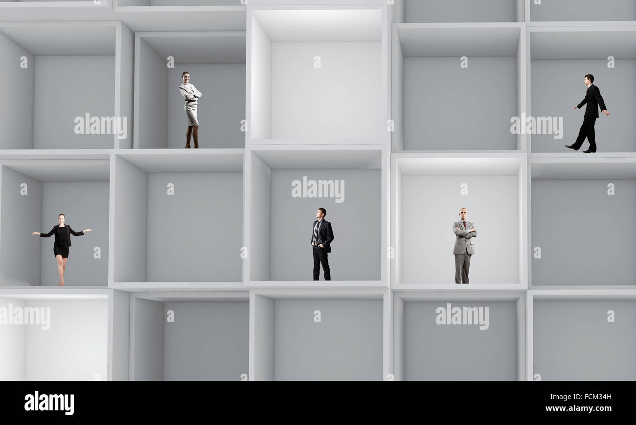 Miniatures of business people standing in cube Stock Photo - Alamy