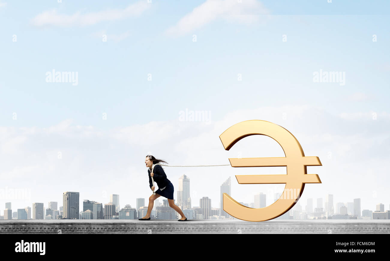 Young businesswoman pulling euro sign with rope Stock Photo - Alamy