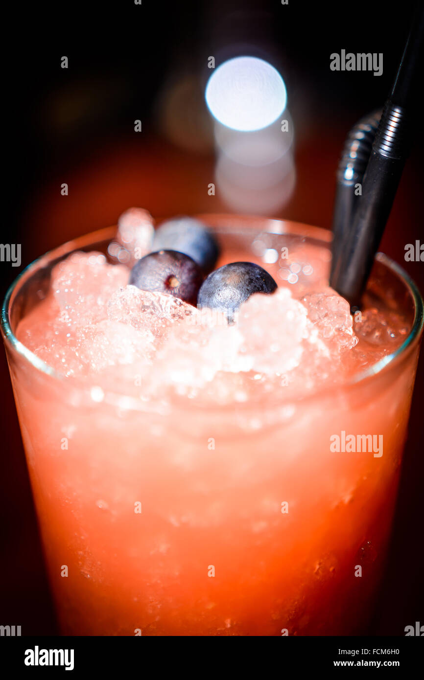 Cocktail with blueberry garnish Stock Photo - Alamy