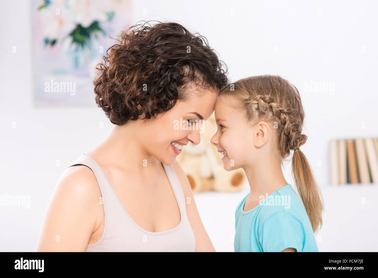 Mother and daughter are grinning to each other Stock Photo - Alamy