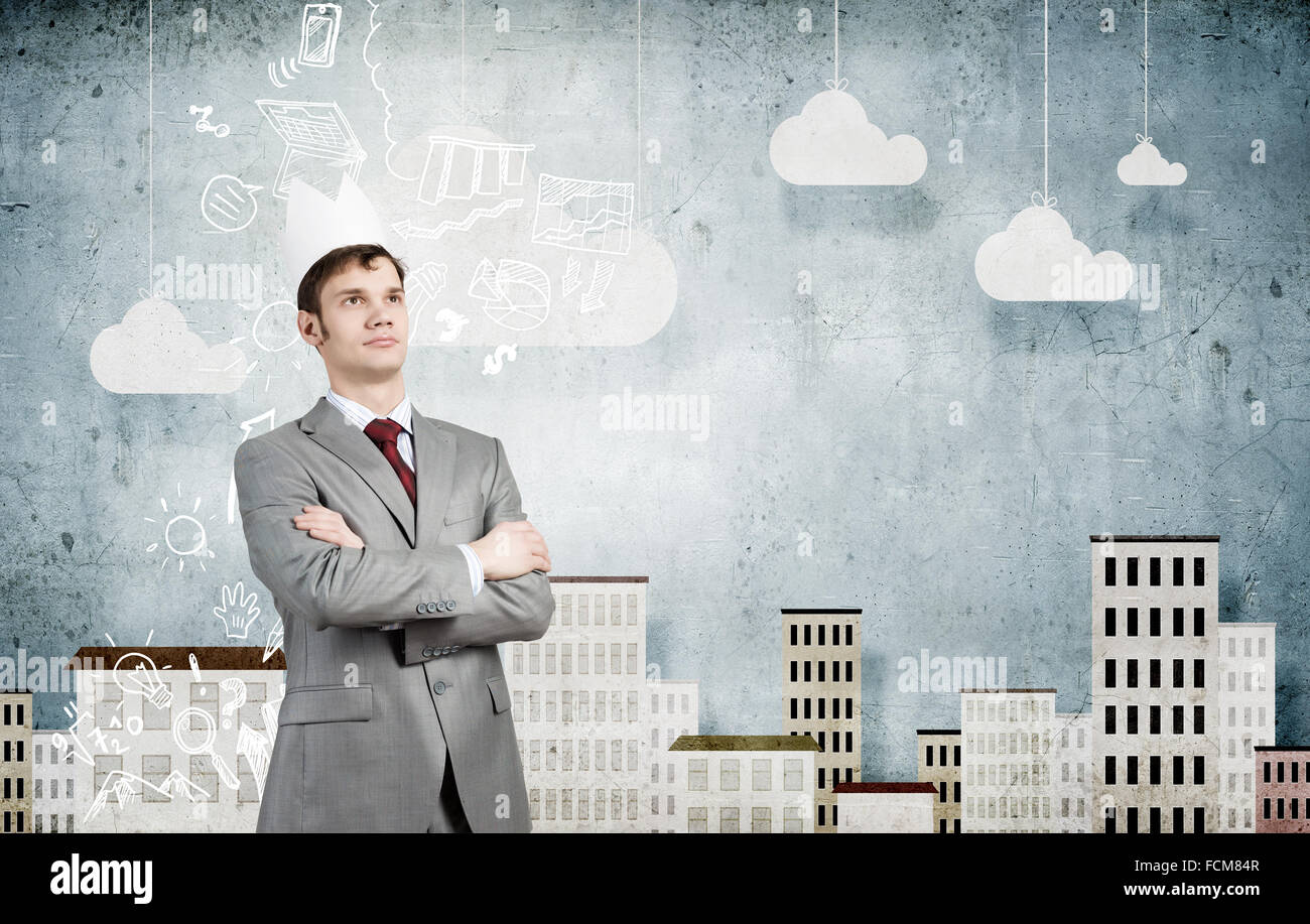Young handsome businessman wearing white paper crown Stock Photo - Alamy