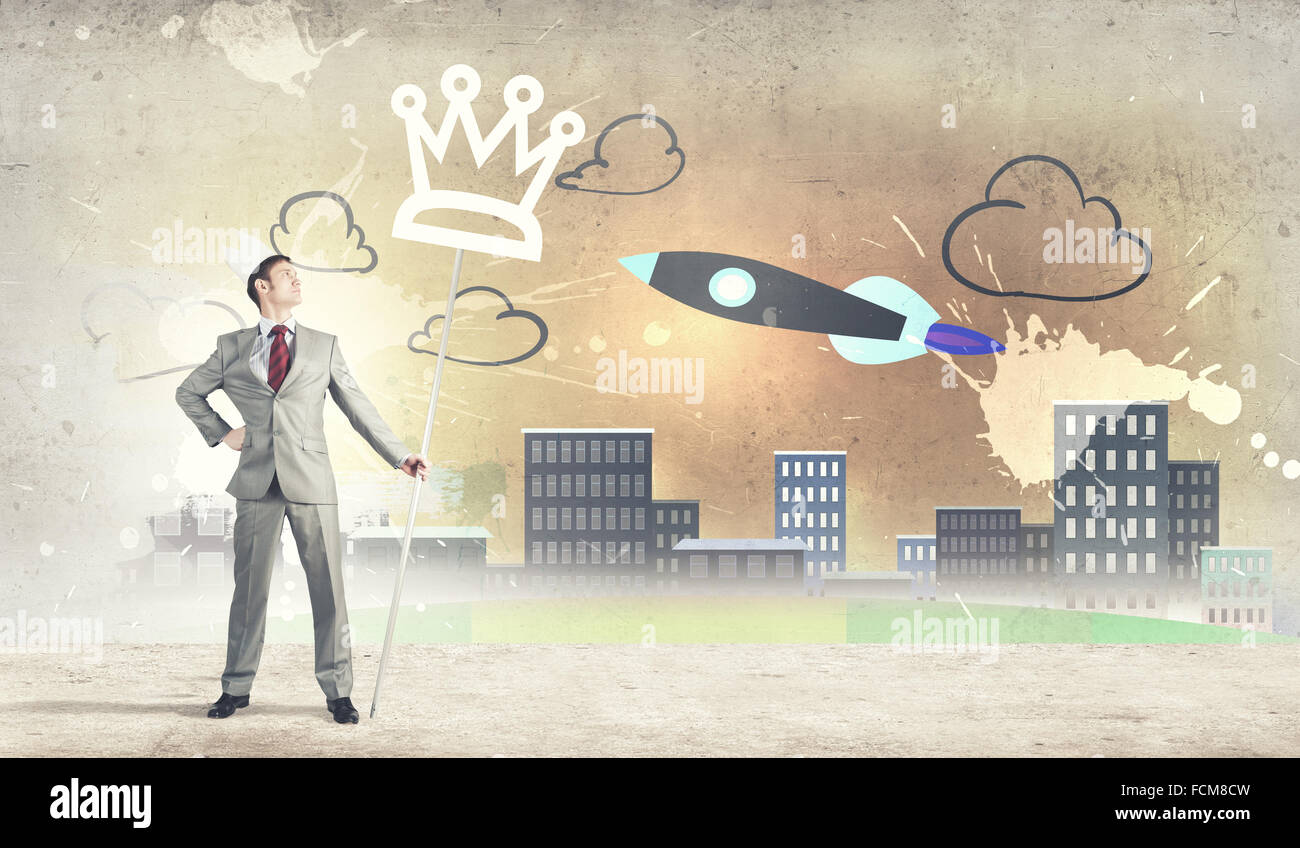 Young handsome businessman wearing white paper crown Stock Photo - Alamy