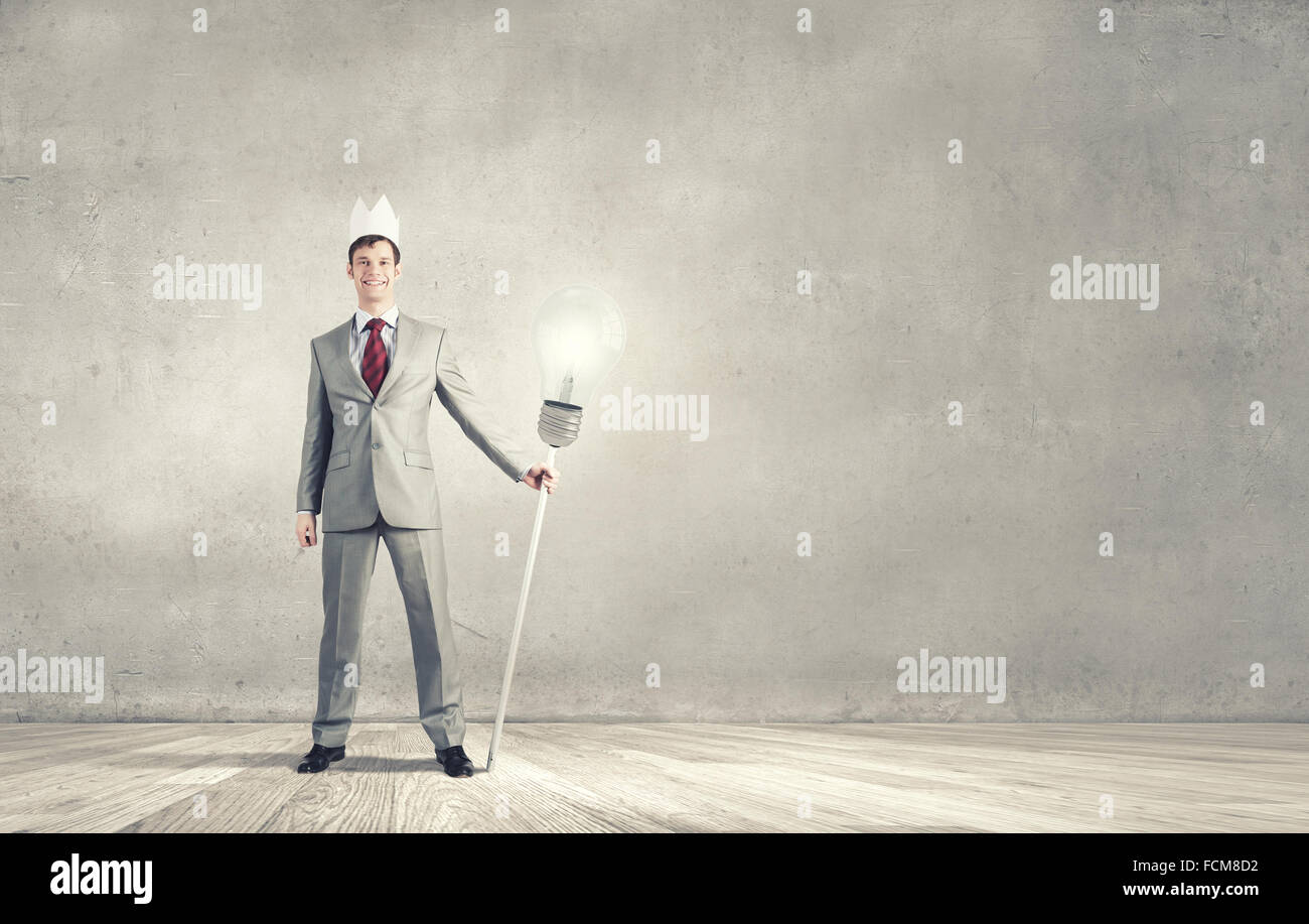 Young handsome businessman wearing white paper crown Stock Photo - Alamy