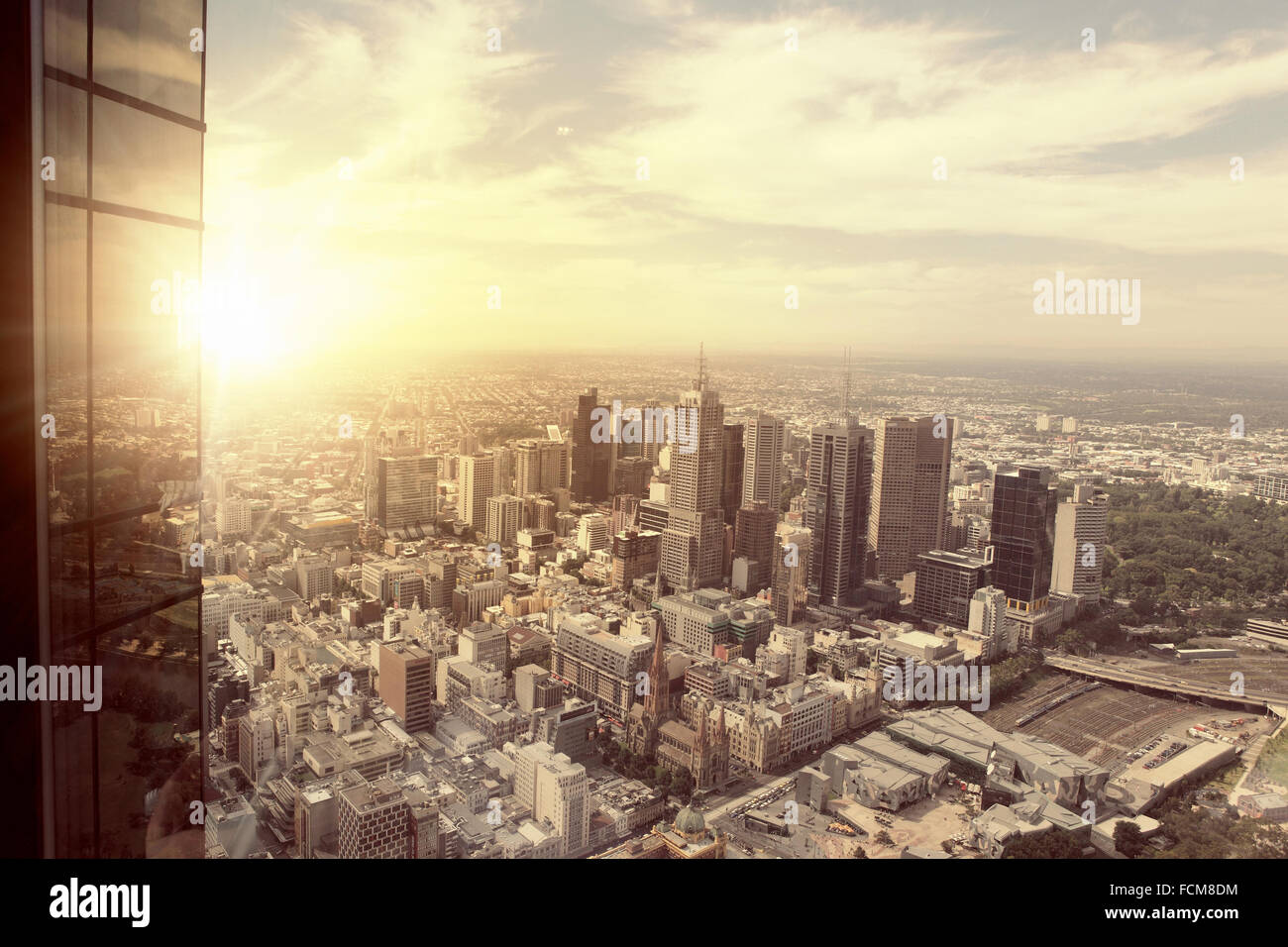 Top view of modern city in lights of sunset Stock Photo - Alamy