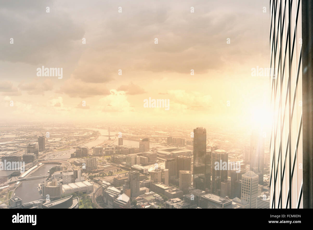 Top view of modern city in lights of sunset Stock Photo - Alamy