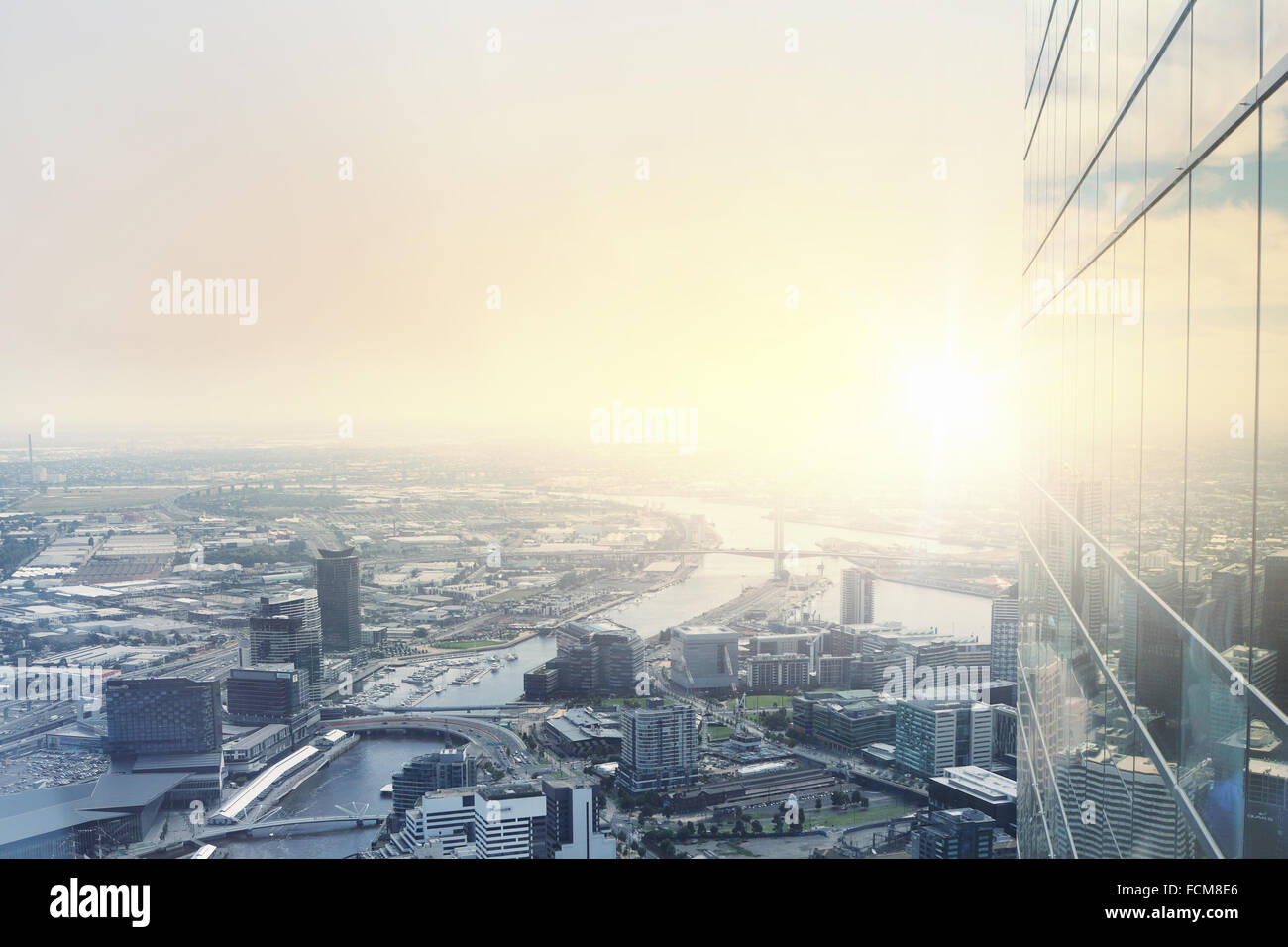 Top view of modern city in lights of sunset Stock Photo - Alamy