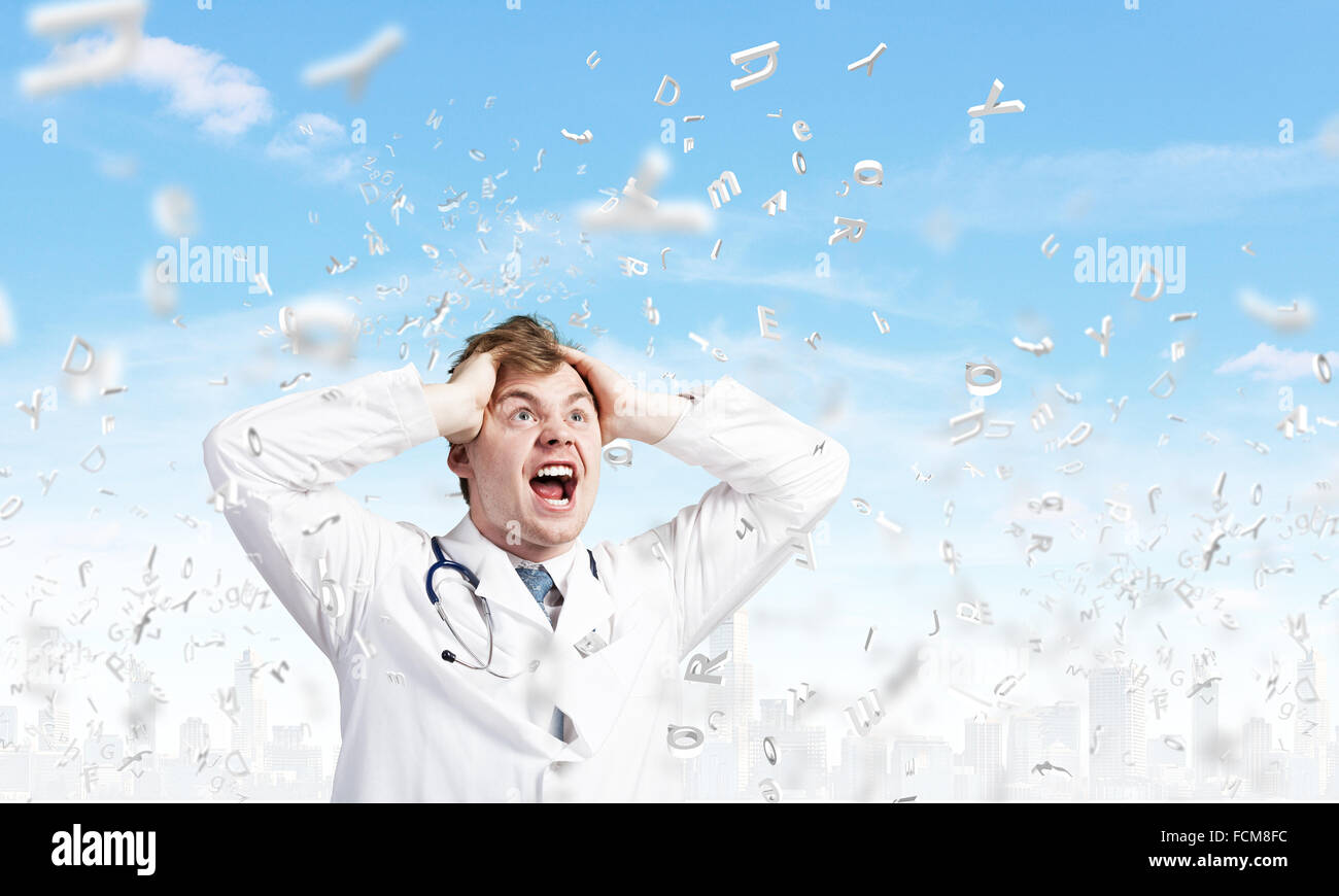 Young frustrated crazy doctor screaming very emotionally Stock Photo ...