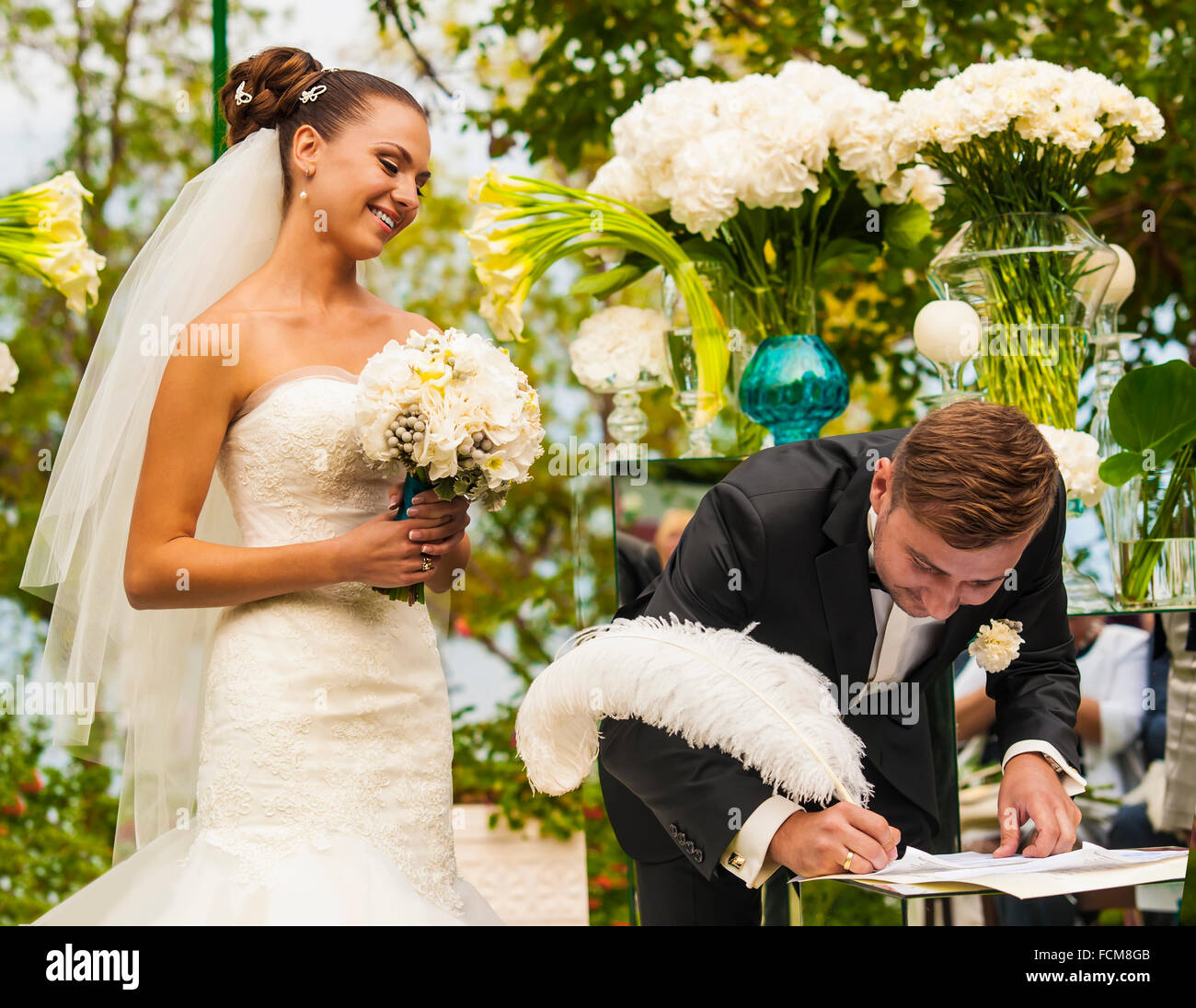 The groom is signing his signature Stock Photo - Alamy