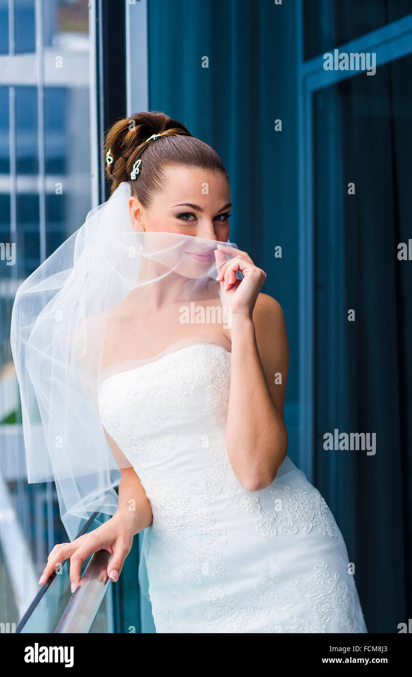 Bride near the window Stock Photo - Alamy