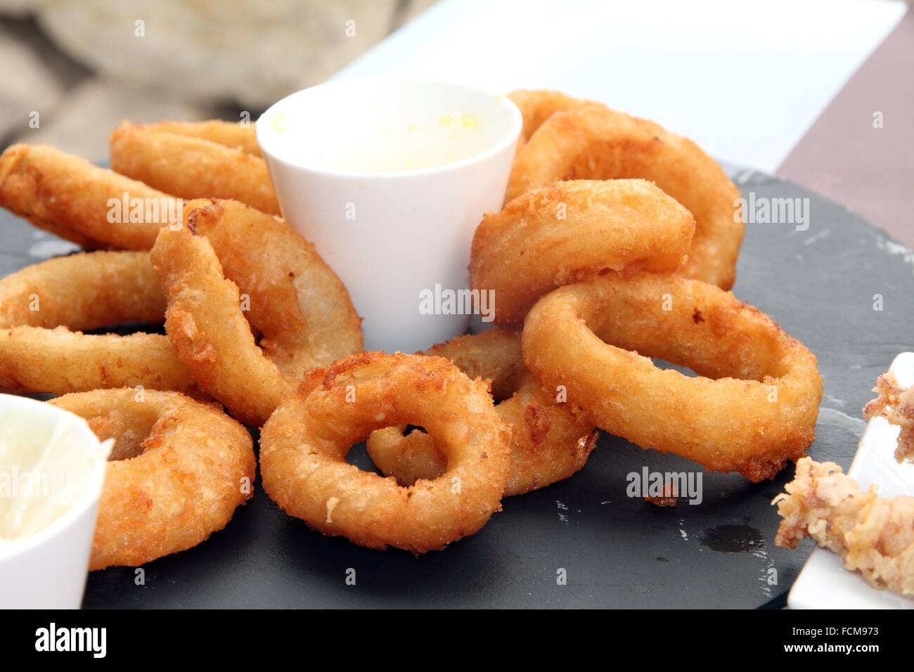 fried squid rings breaded Stock Photo - Alamy