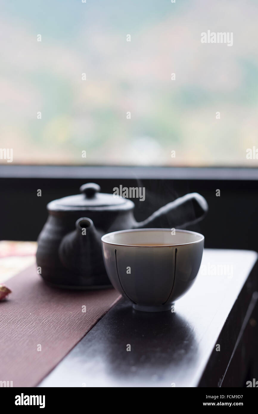 Still life of Japanese Green Tea cup and tea pot on a table Stock Photo ...