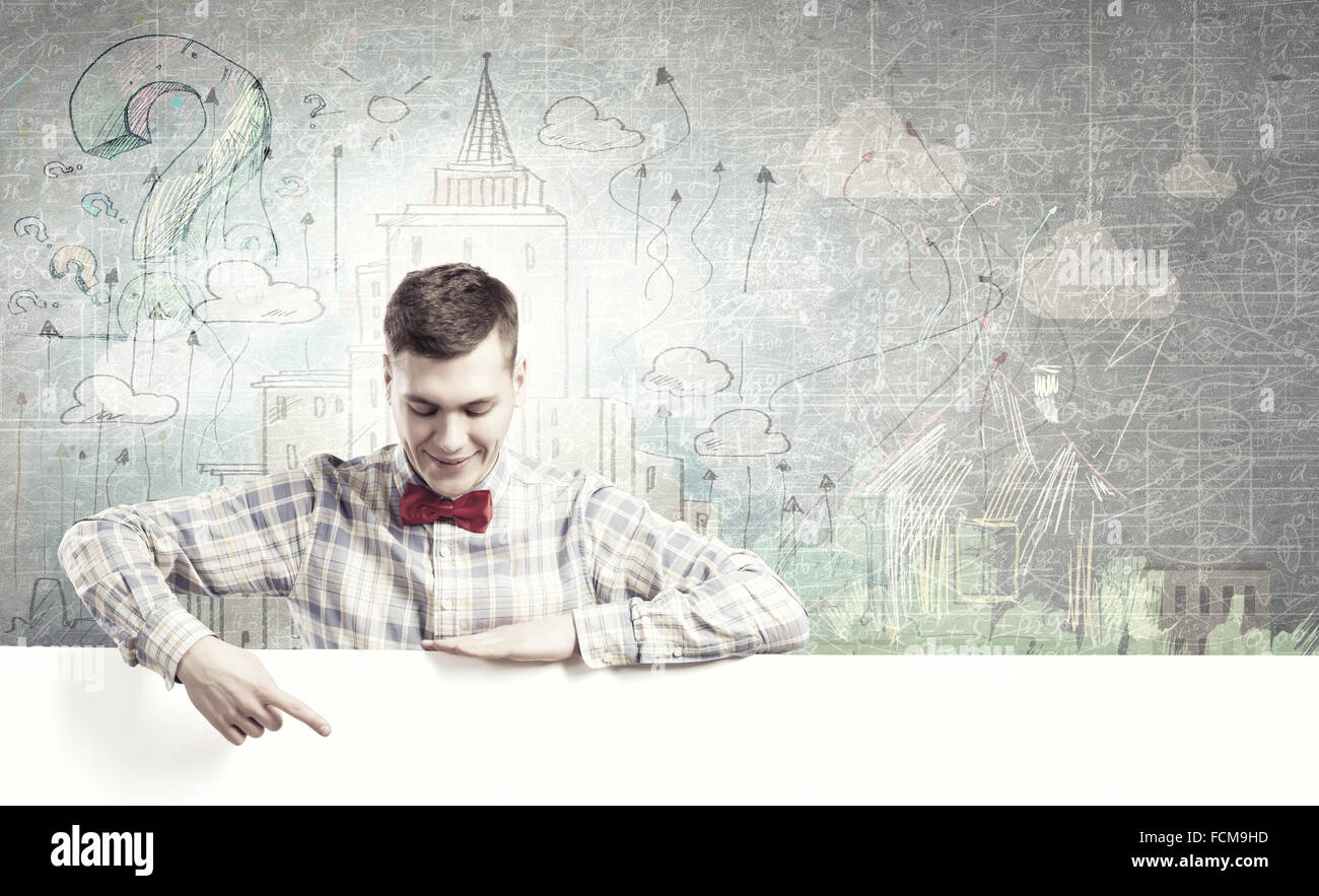 Young man with white blank banner. Place for text Stock Photo - Alamy