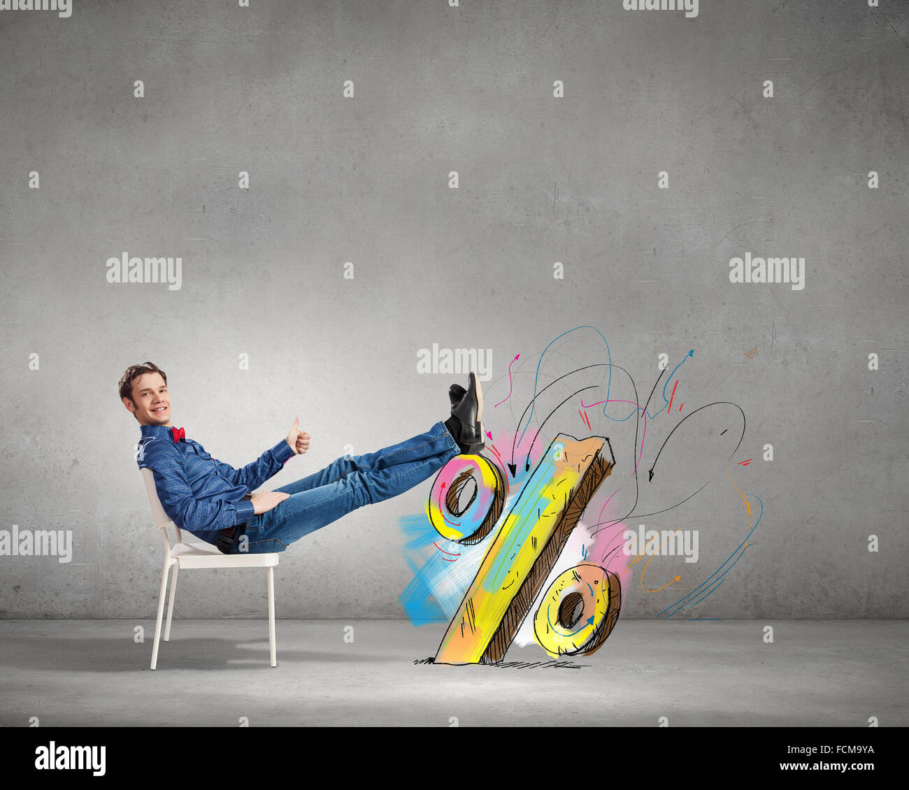 Young man sitting in chair with legs up and relaxing Stock Photo - Alamy