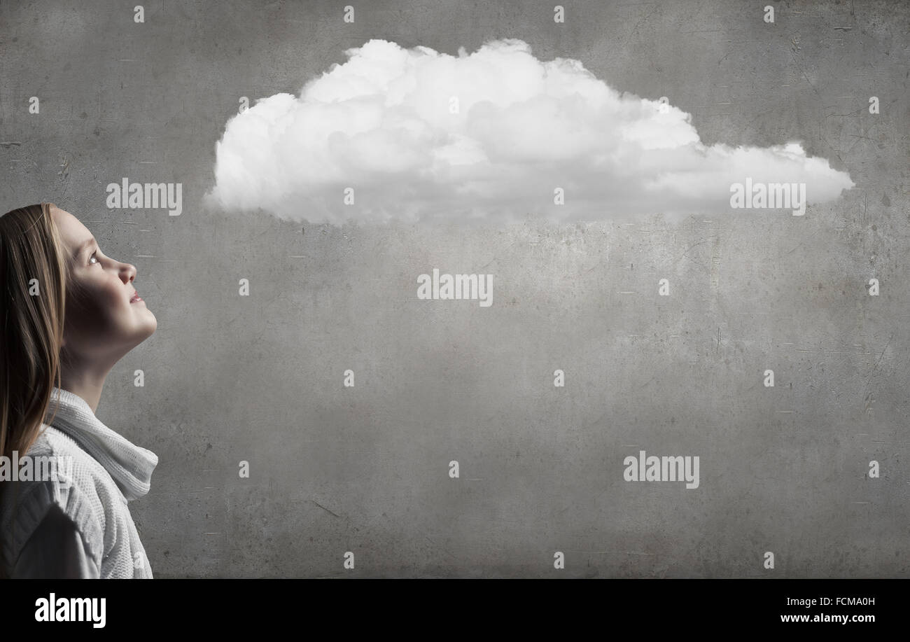 Side view of cute girl of school age looking up Stock Photo - Alamy