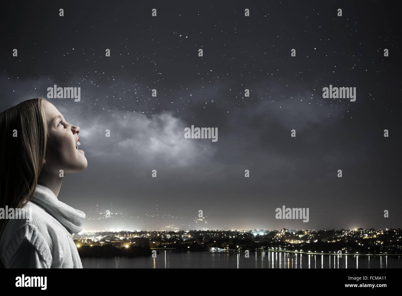 Side view of cute screaming girl against dark background Stock Photo ...