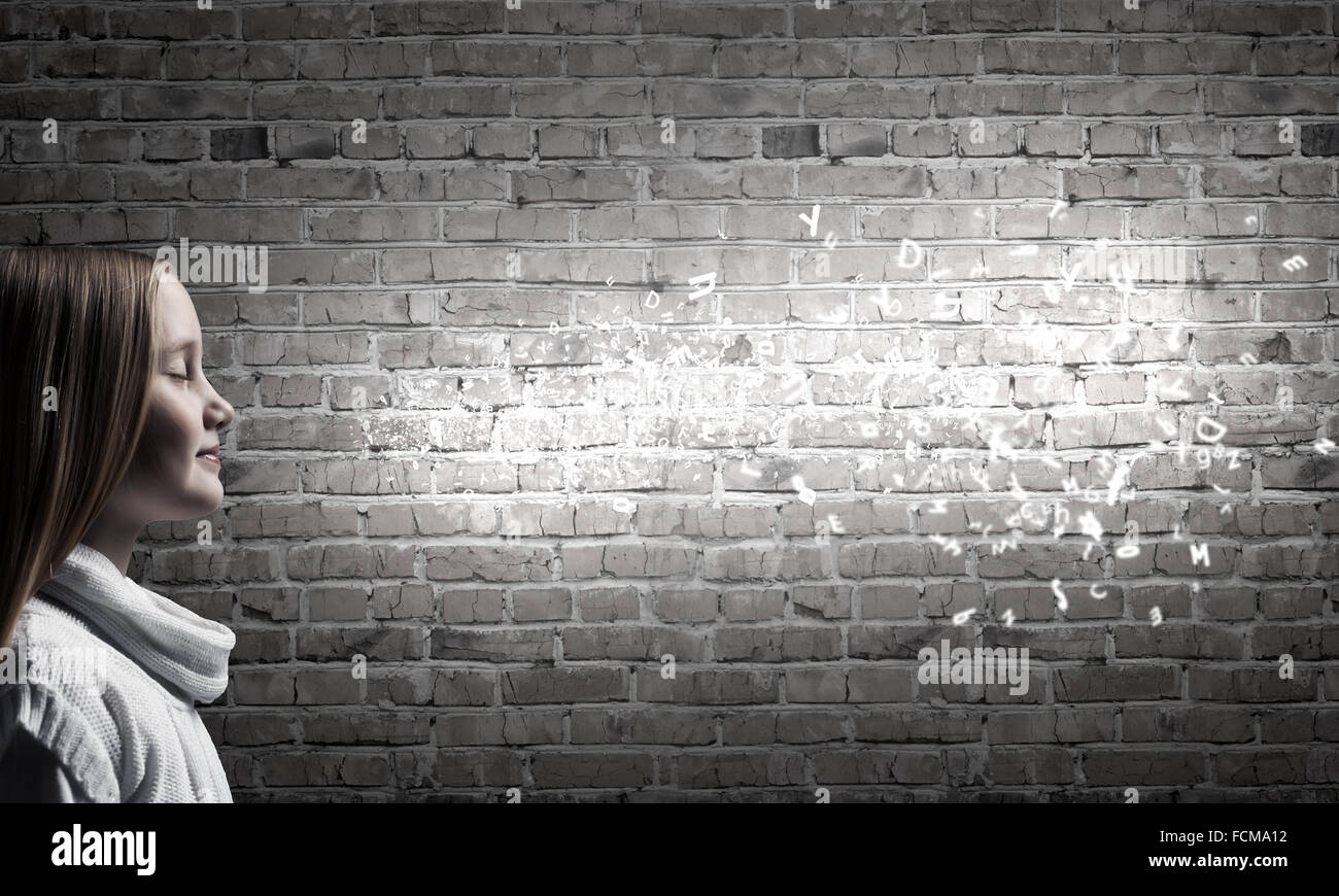 Side view of cute screaming girl against dark background Stock Photo ...