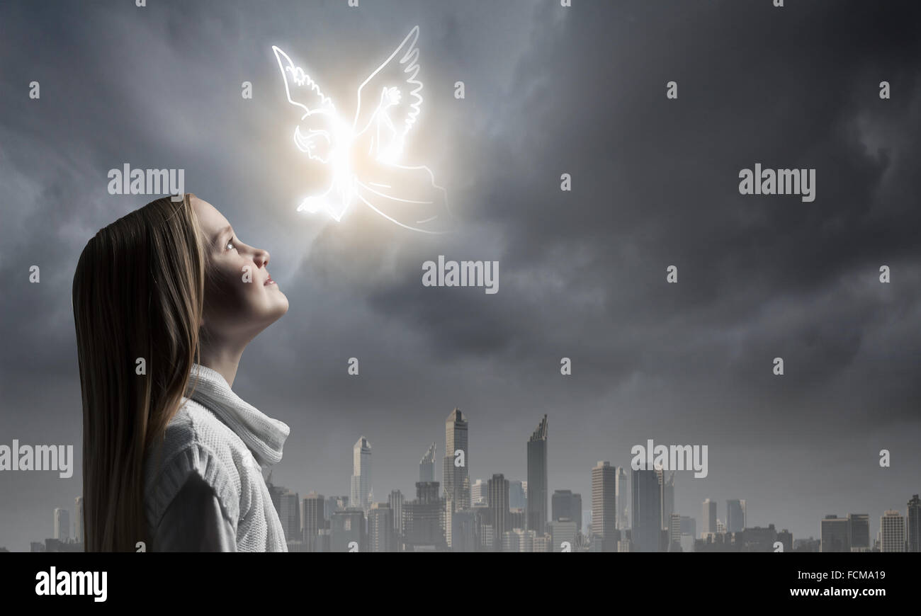 Side view of cute girl of school age looking up Stock Photo - Alamy